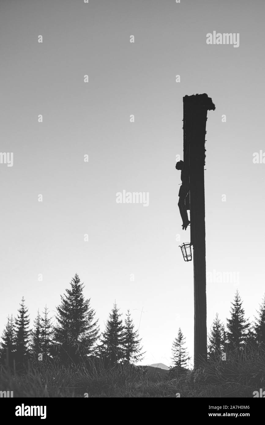 Wooden crucifix profile against mountain forest Stock Photo - Alamy