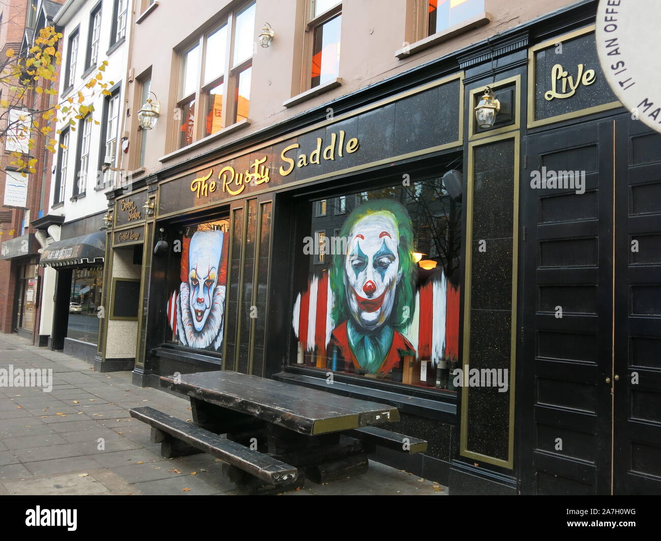 Windows decorated with clowns artwork at the Rusty Saddle, a Belfast ...