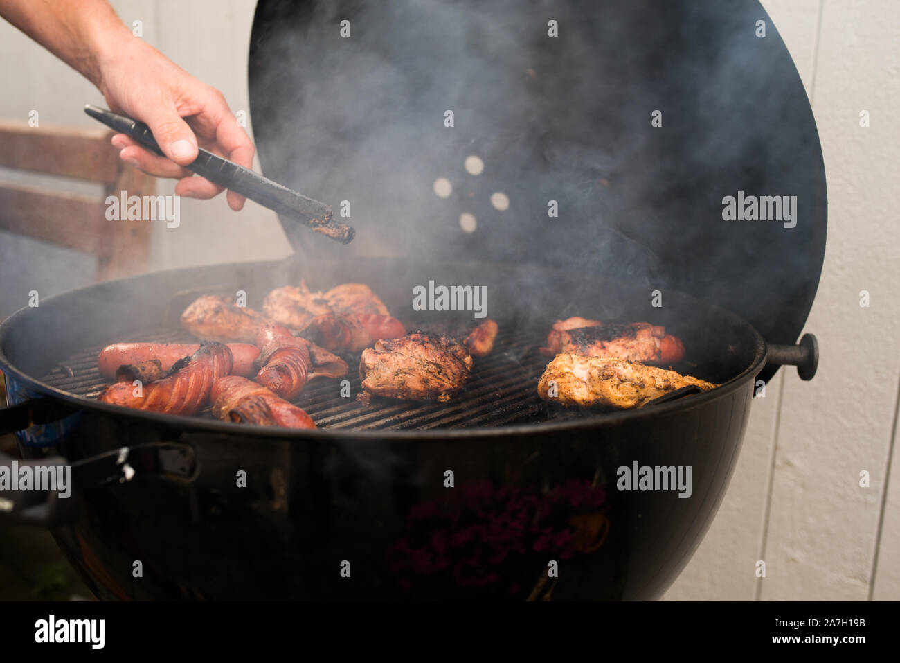 Hand grilling meat barbeque barbeque hi-res stock photography and ...