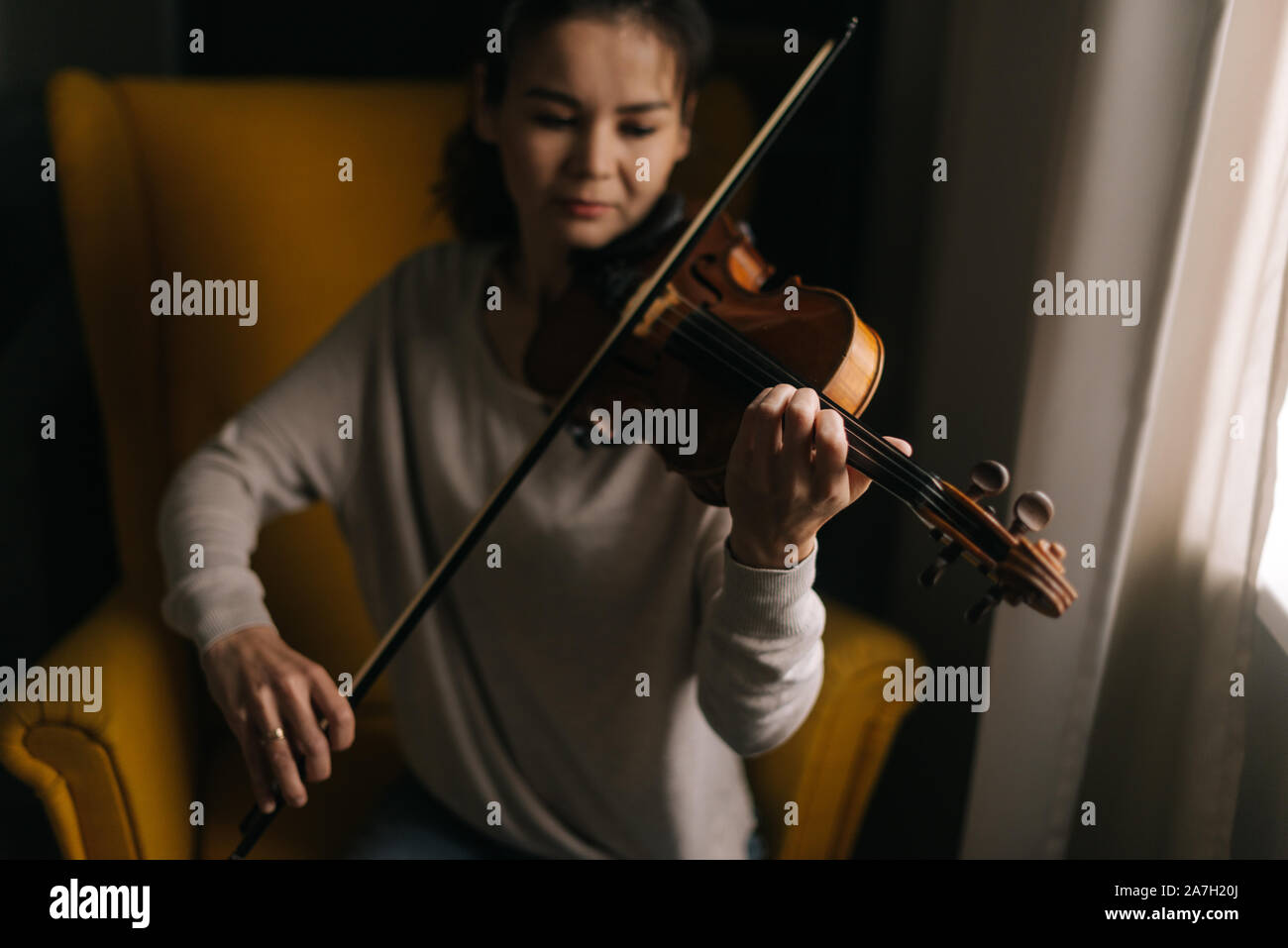 Asian girl playing cello hi-res stock photography and images - Alamy