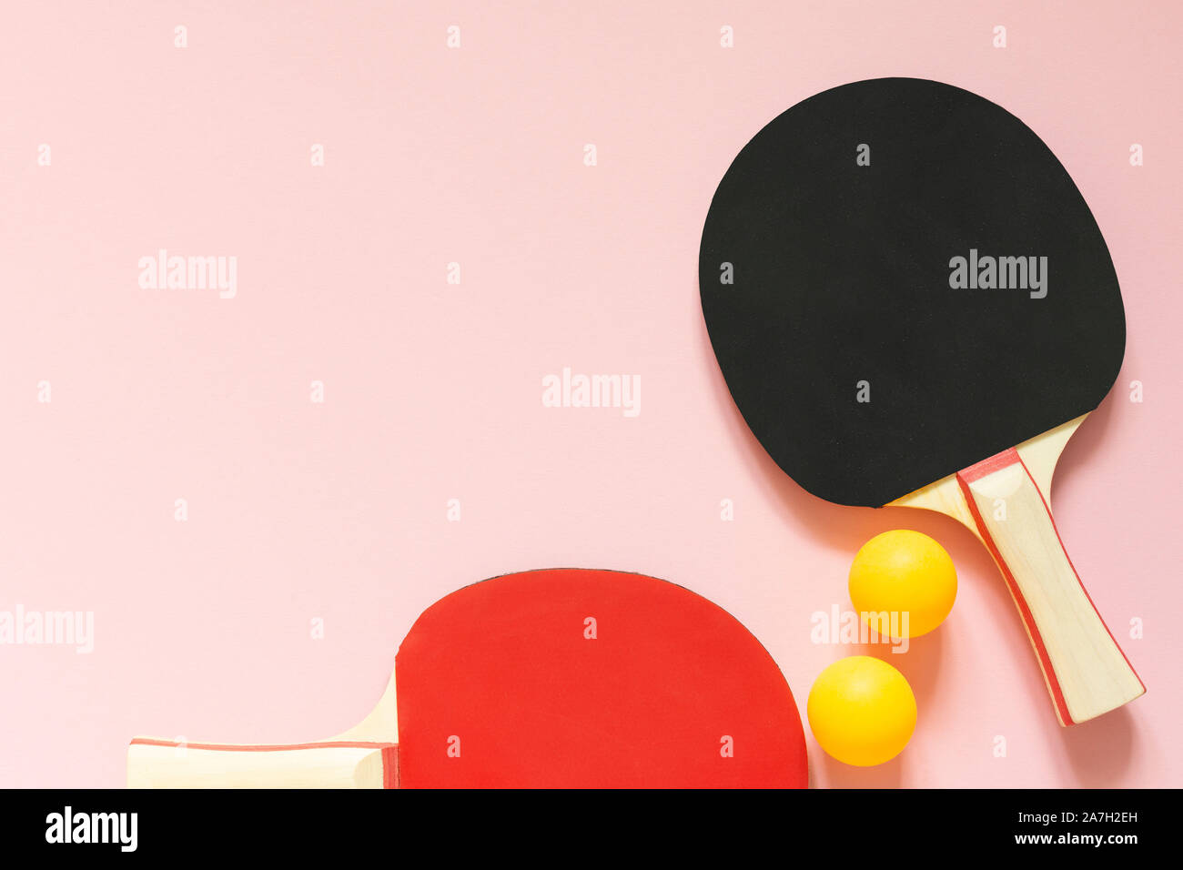 Black and red tennis ping pong rackets and orange balls isolated on a ...
