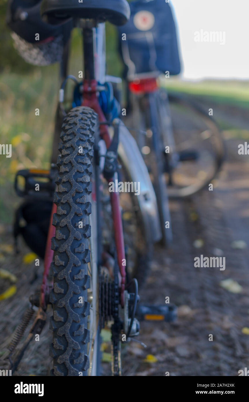 Closeup of the tread of a wheel of a bicycle standing on the road Stock ...