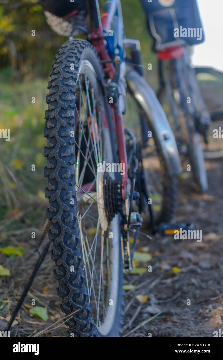 Closeup of the tread of a wheel of a bicycle standing on the road Stock ...