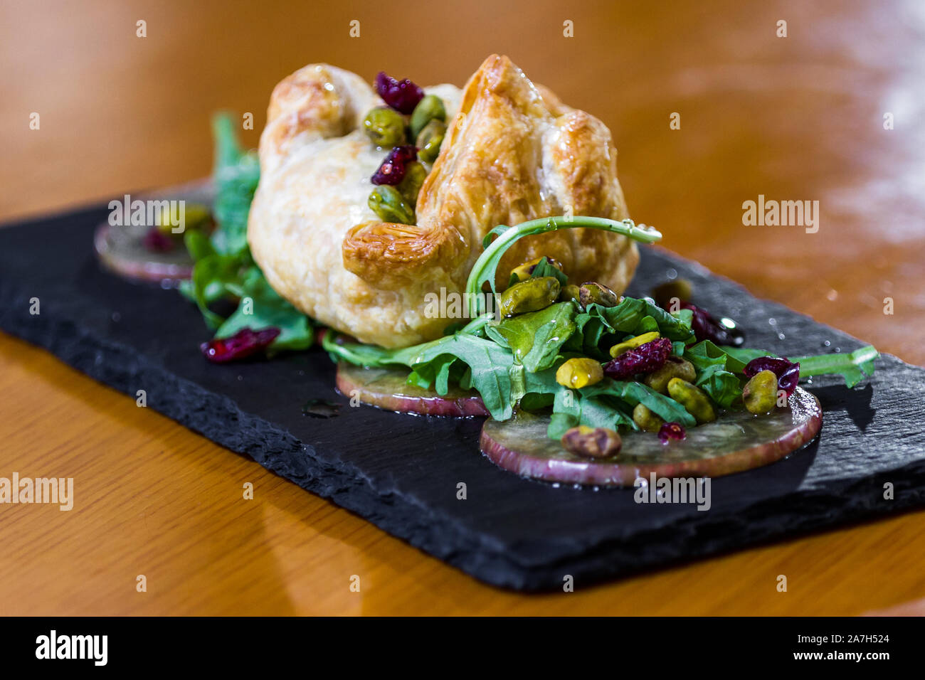 baked brie stuffed in a puff pastry served with seasonal fruit and ...
