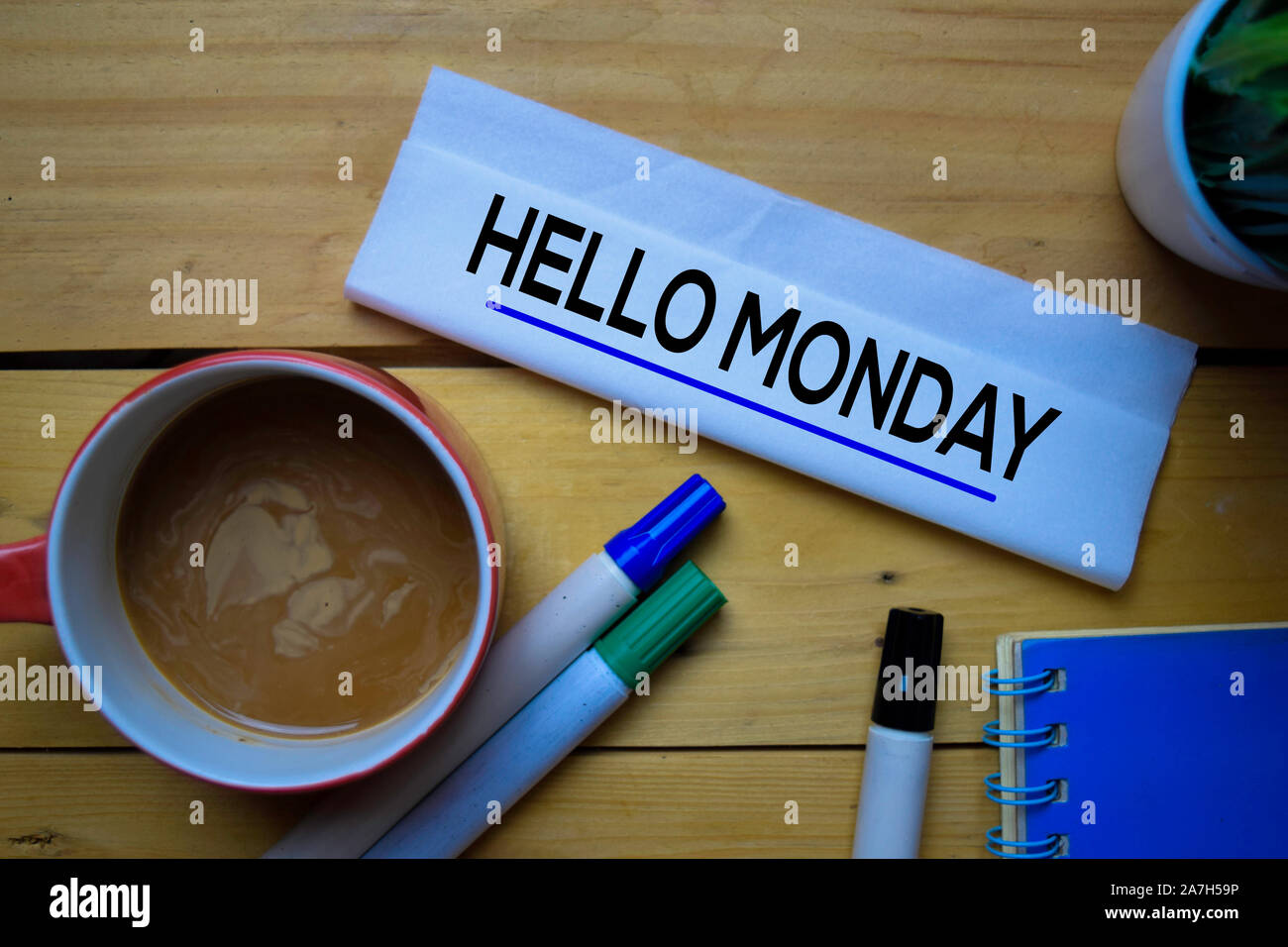 Hello Monday write on the tissue with wooden table background Stock ...