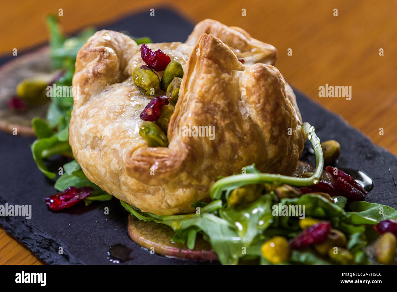 baked brie stuffed in a puff pastry served with seasonal fruit and ...