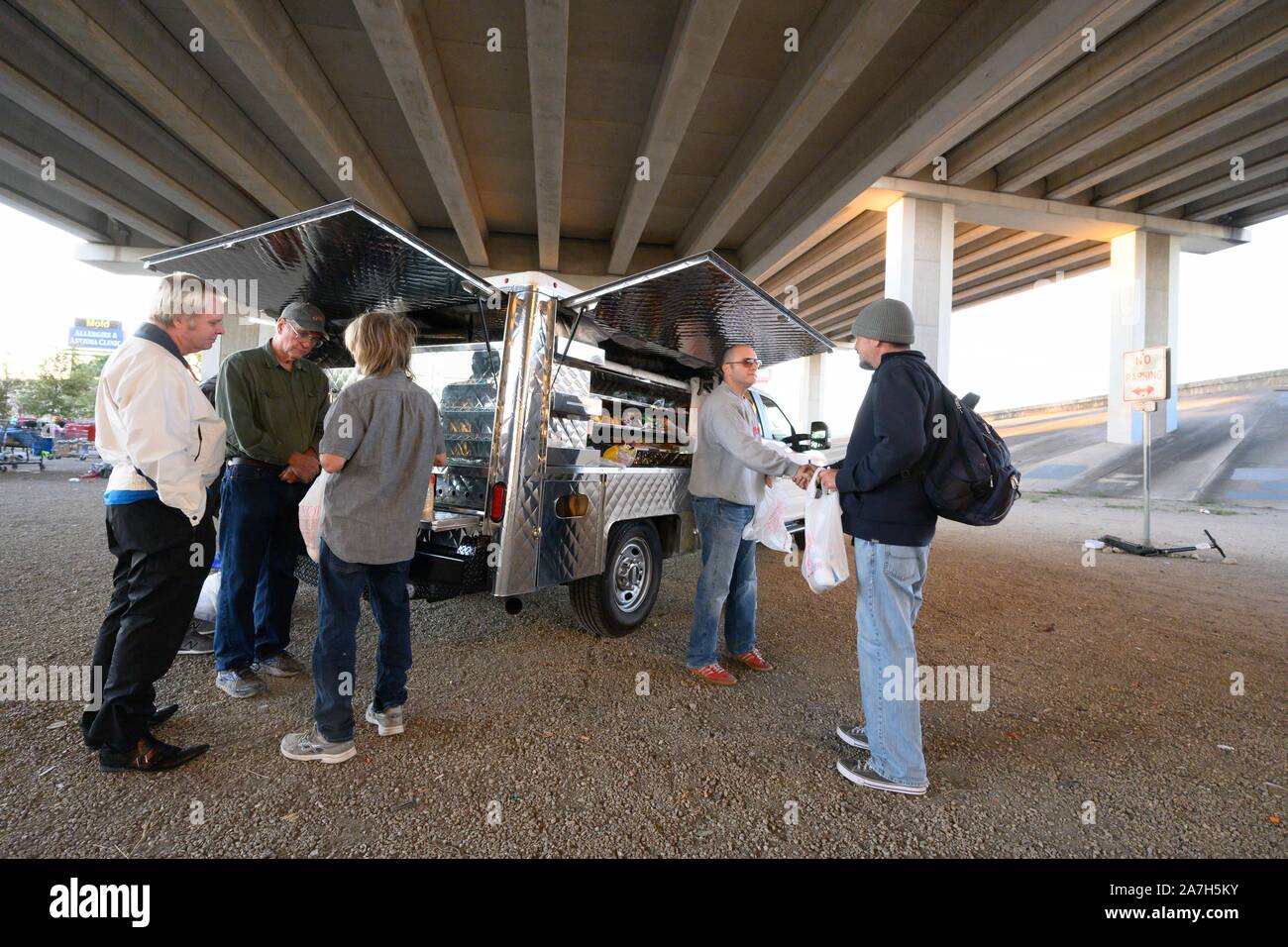 Volunteers with Mobile Loaves and Fishes, an Austin-based ministry ...