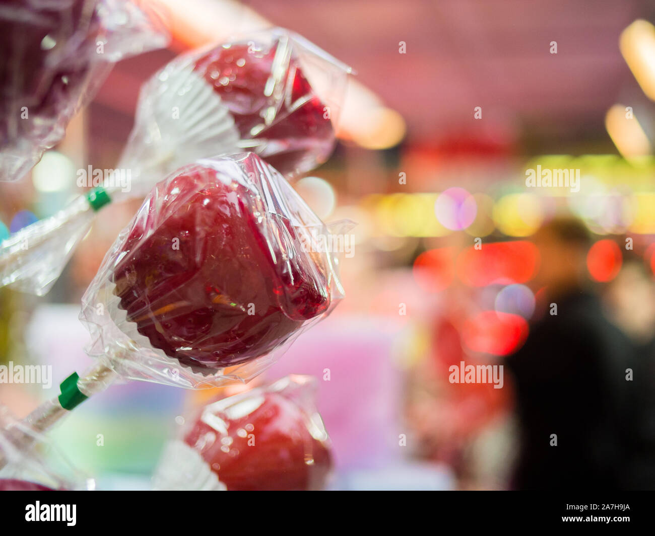 candy apples at a funfair stand with blurred background Stock Photo - Alamy