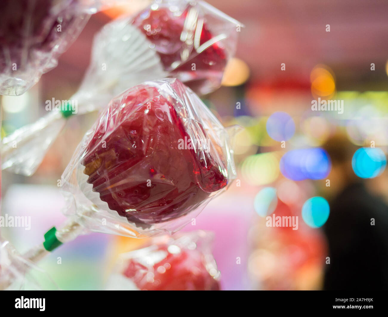 candy apples at a funfair stand with blurred background Stock Photo - Alamy