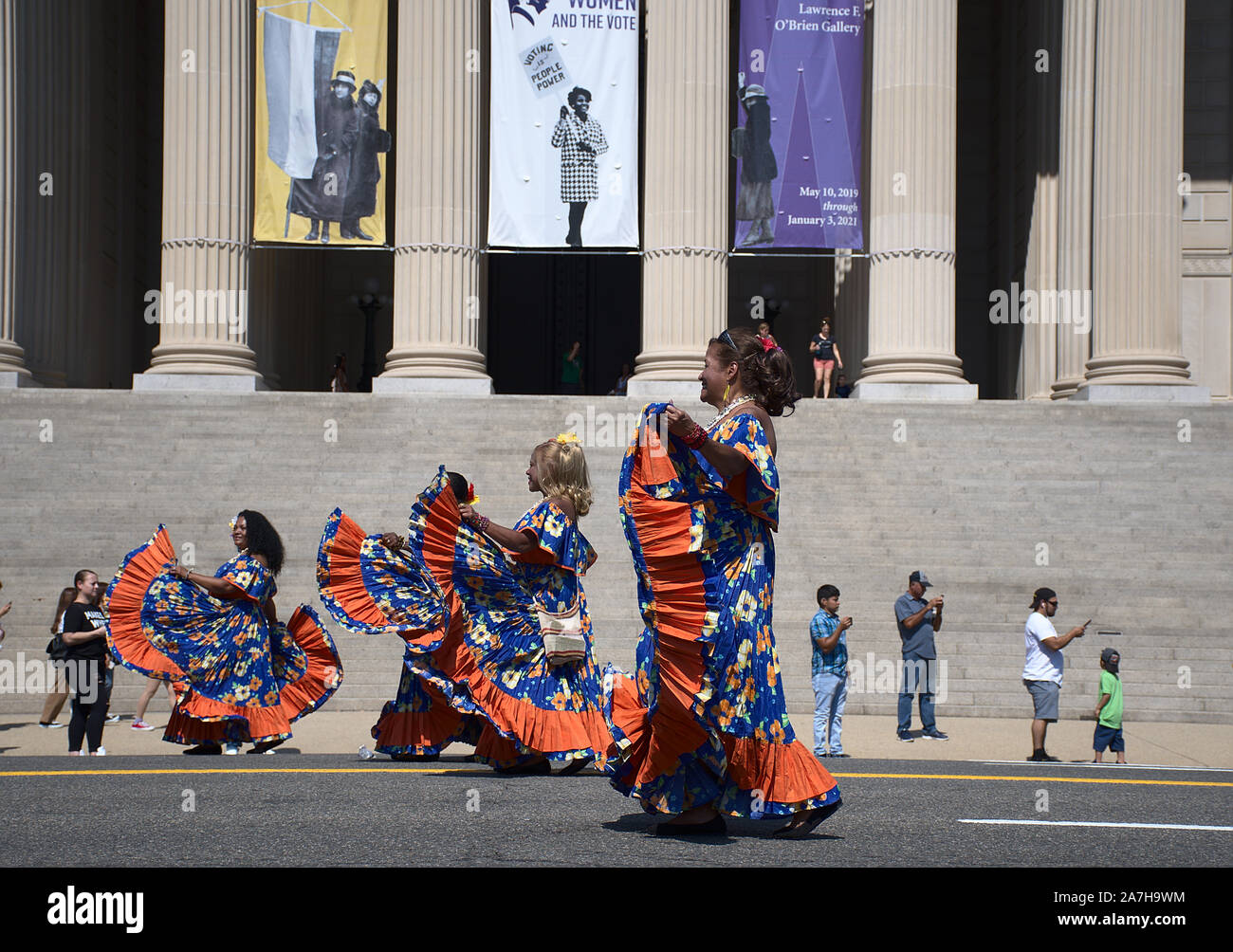 Women in flowing traditional dress dancing in Fiesta DC parade 2010 ...