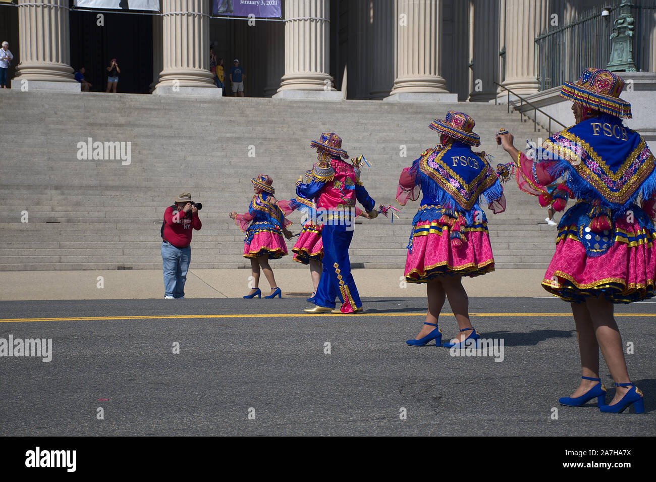 Females with South American heritage dancing in colorful traditional ...