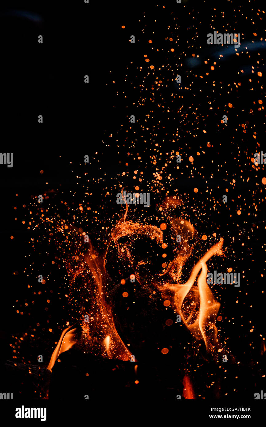 Embers and Flames erupt from outdoor campfire Stock Photo - Alamy