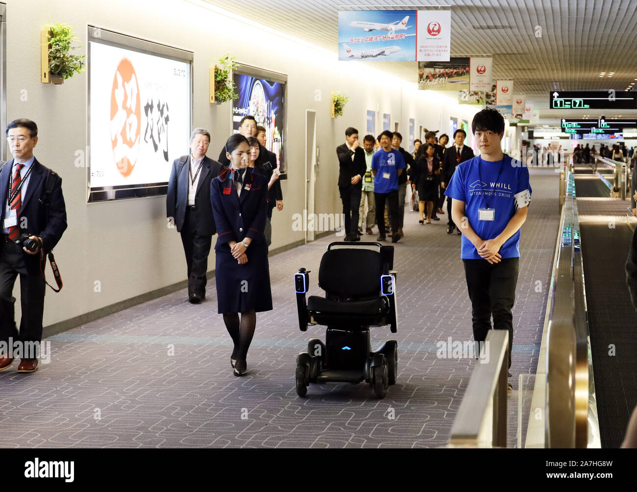 Tokyo, Japan. 2nd Nov, 2019. An electric vehicle WHILL returns from a ...