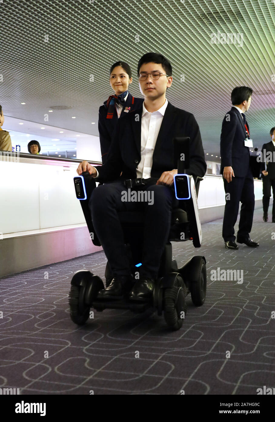 Tokyo, Japan. 2nd Nov, 2019. A man drives a personal electric vehicle ...