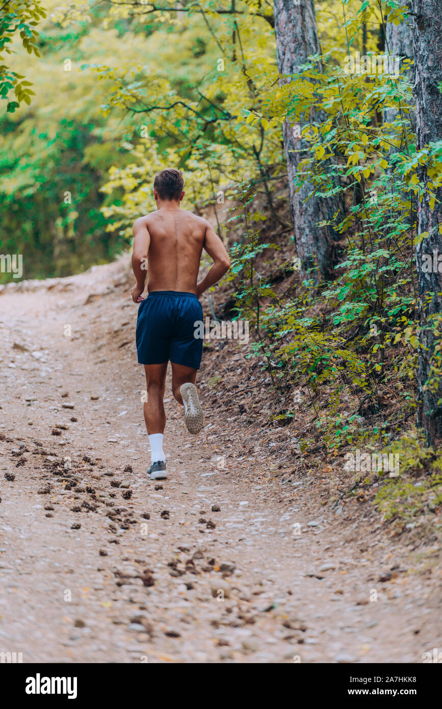Runner Man running with concentration, determination and strength ...