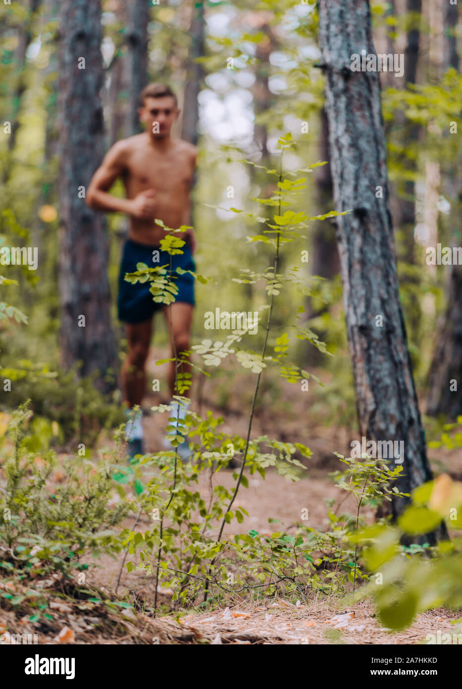 Runner Man running with concentration, determination and strength ...