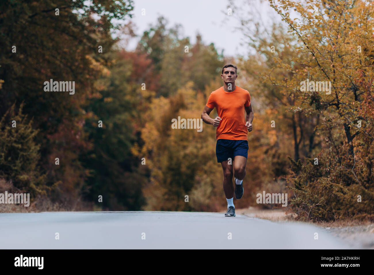 Running man runner sprinting for fitness and health. Full body length ...