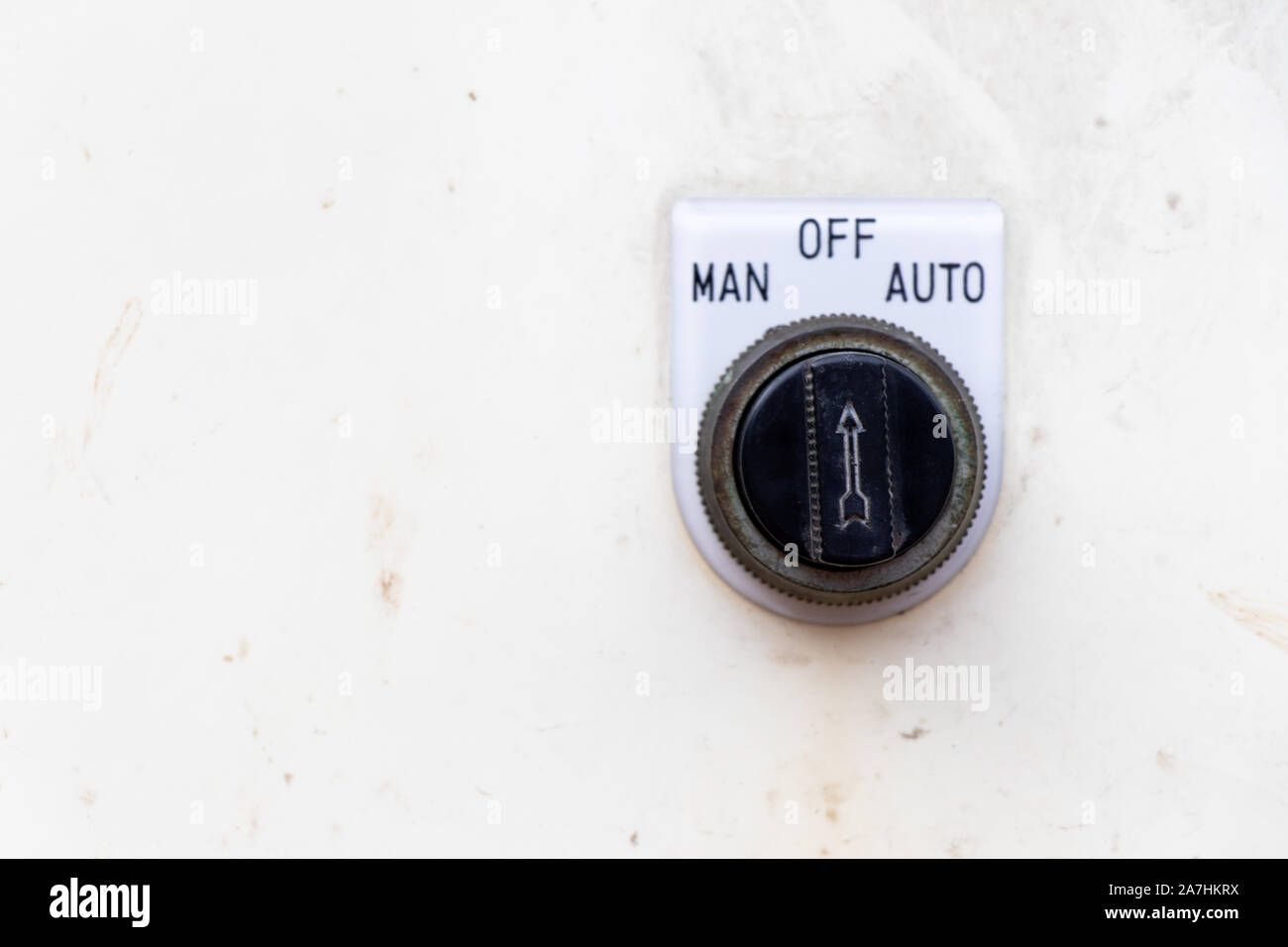 Black switch that have arrow symbol point to off position and have ...