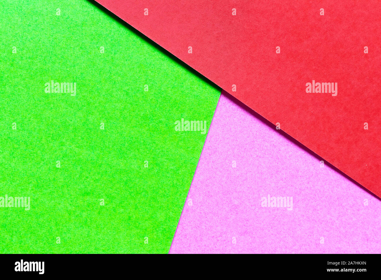 Abstract green, pink and red color paper textured background with copy ...