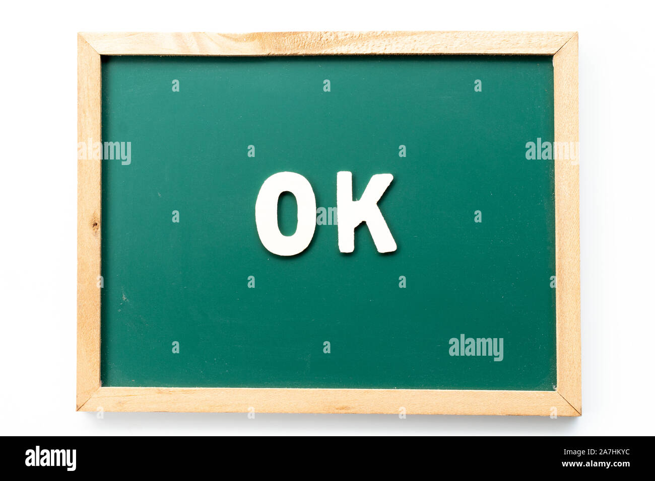 Letter in word OK on blackboard in white background Stock Photo - Alamy