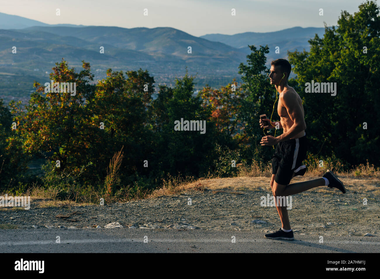 Runner sprinter at fast speed training towards goals and success ...