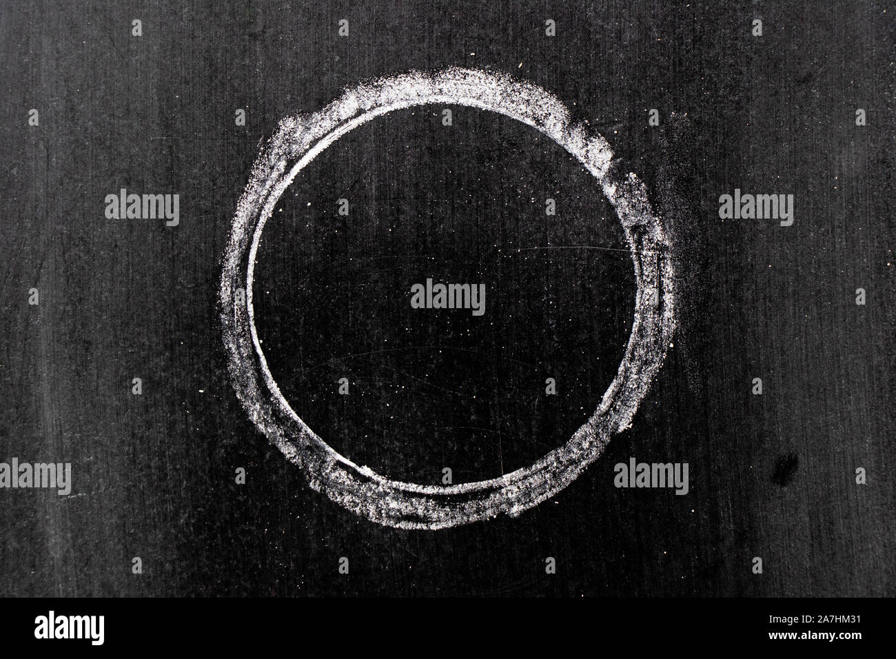 White chalk hand drawing in circle or round shape on black board ...