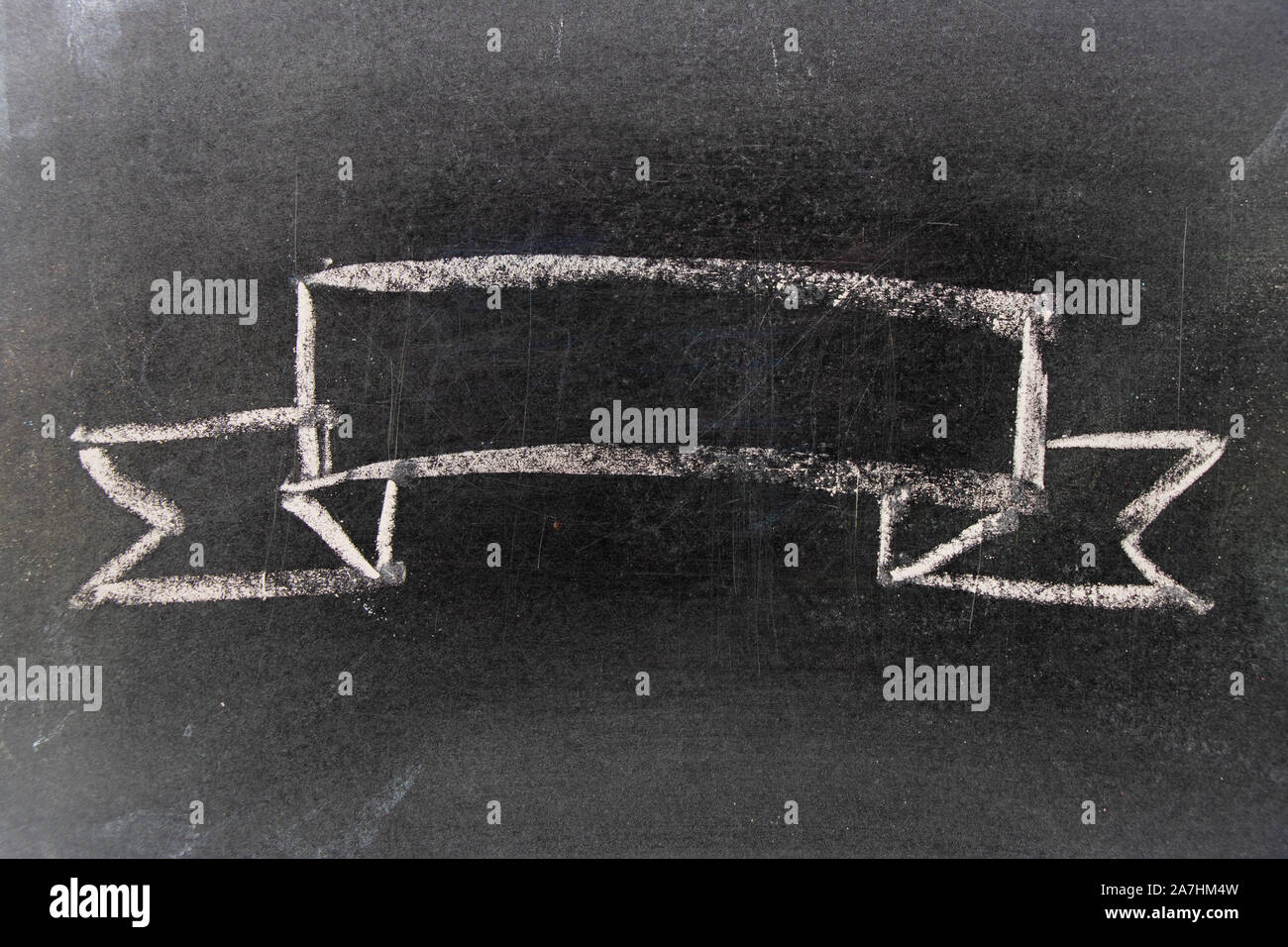 White chalk hand drawing in blank award ribbon shape on blackboard ...