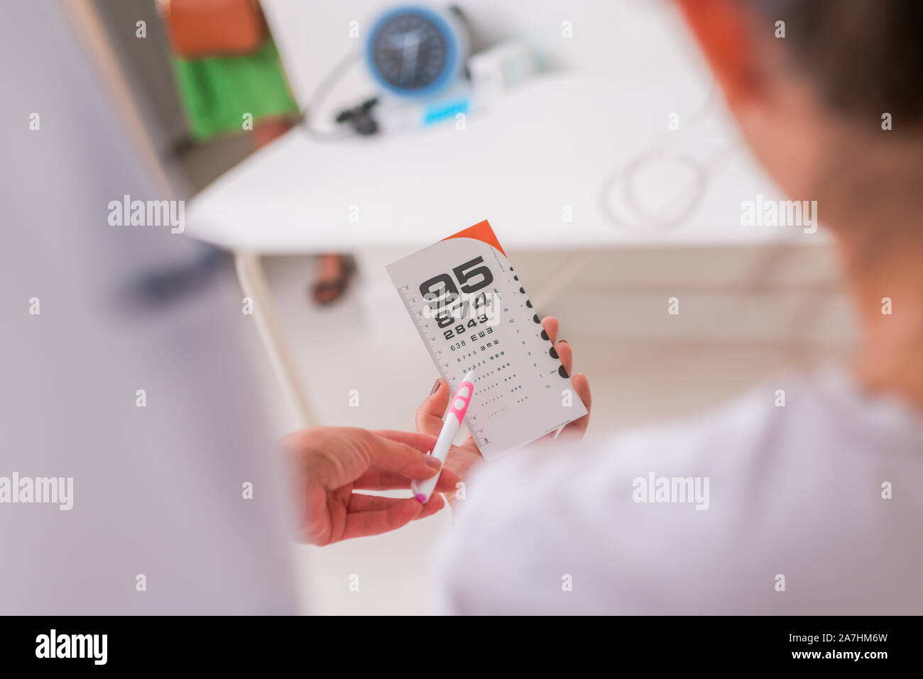 Woman ( girl )reviewing eyesight closing eye with hand. Eye test ...