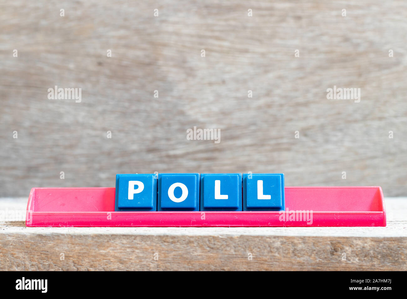 Tile letter on red rack in word poll on wood background Stock Photo - Alamy