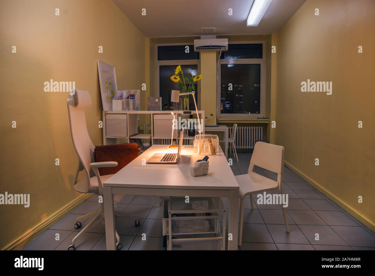 Doctors work at the office at night on a pc ( computer Stock Photo - Alamy