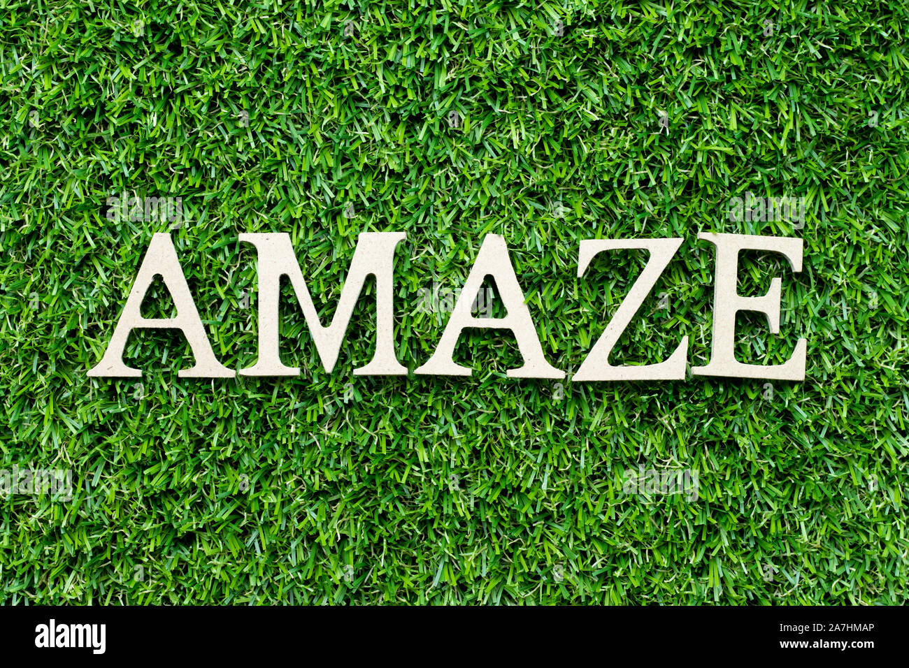 Wood alphabet letter in word amaze on green grass background Stock ...