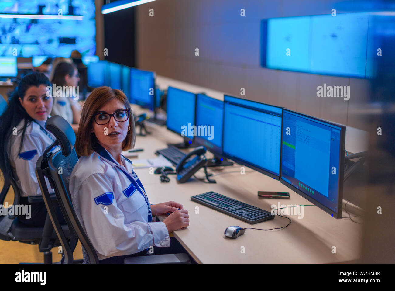Male computer operator monitoring from a security ( computer, logistic ...