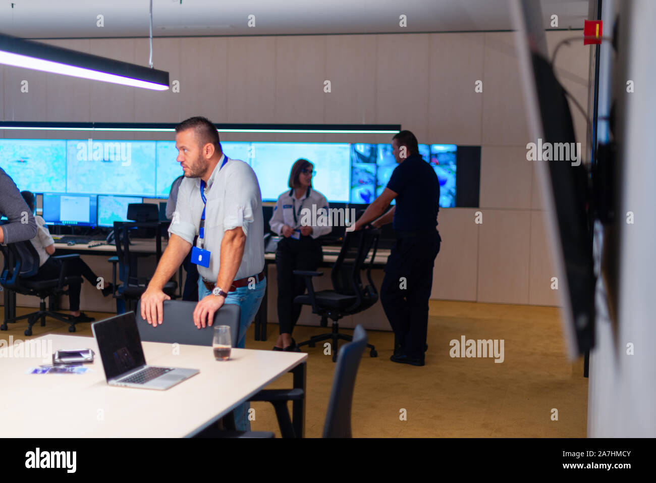 Male computer operator monitoring from a security ( computer, logistic ...