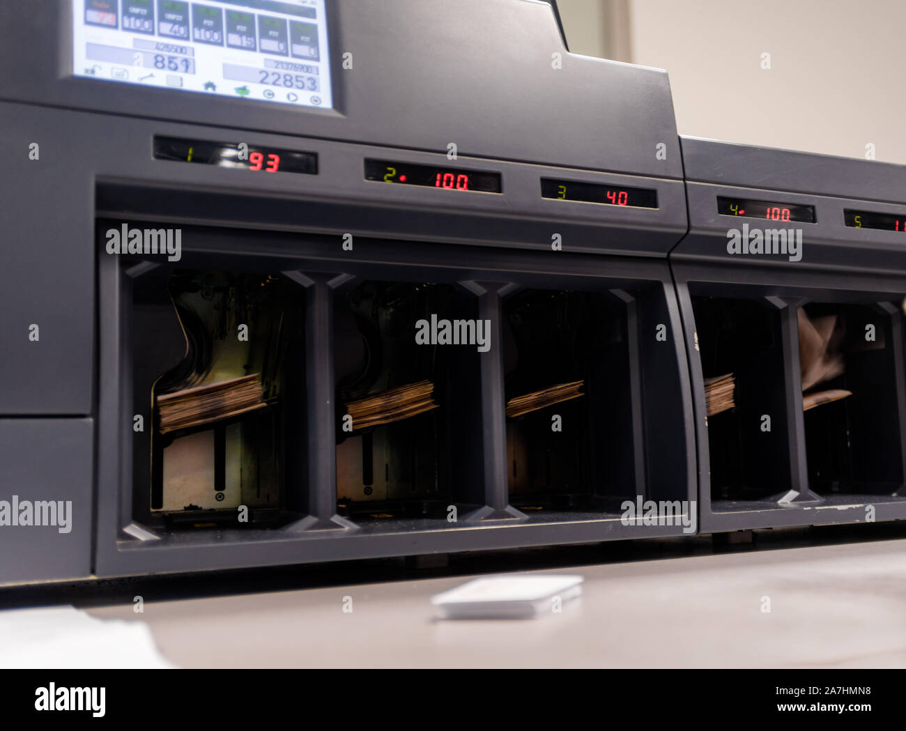 Electronic counter for money with multiple slots and a digital ...