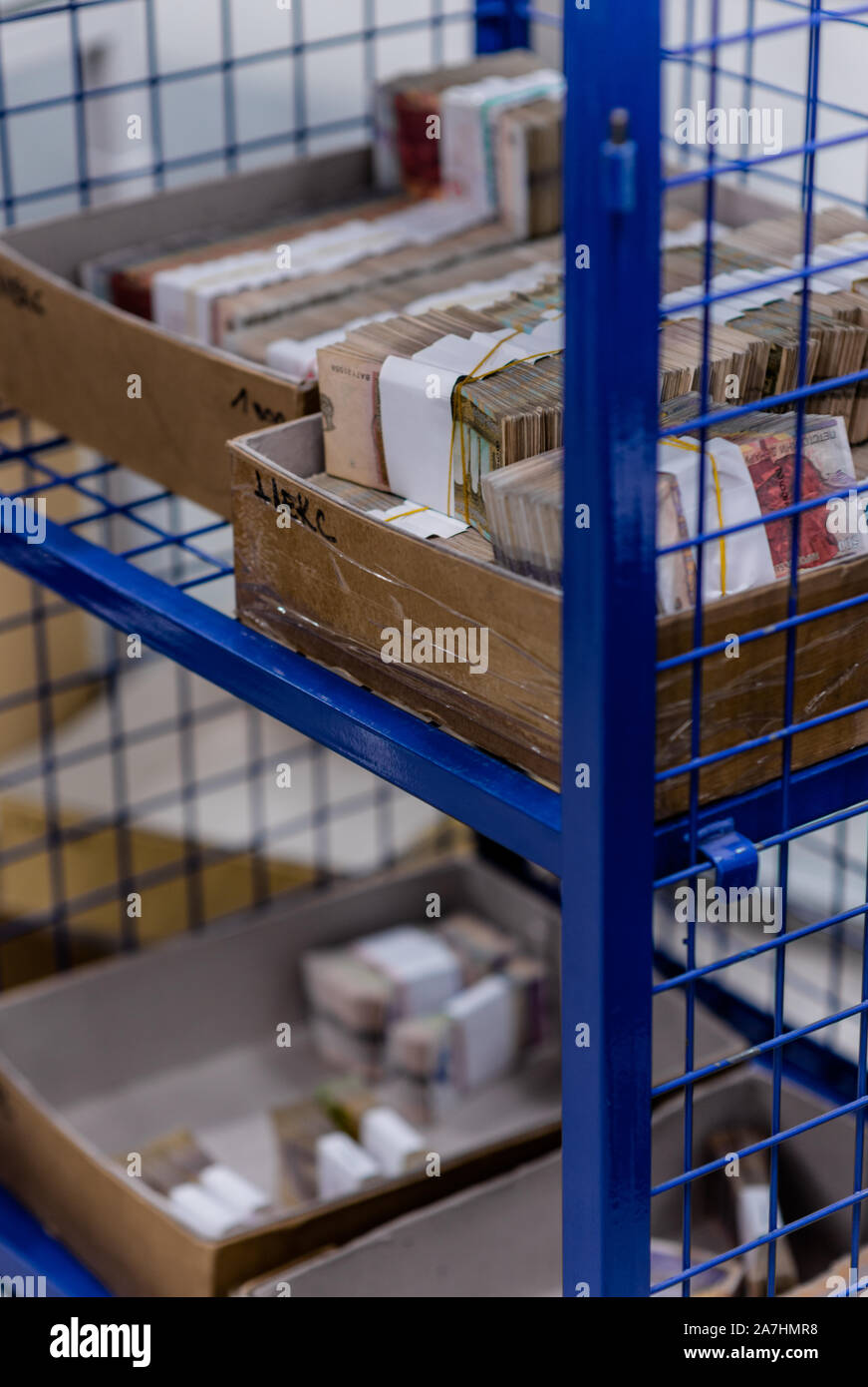 Metal blue cage that is used for storage and trasnportation of boxes ...
