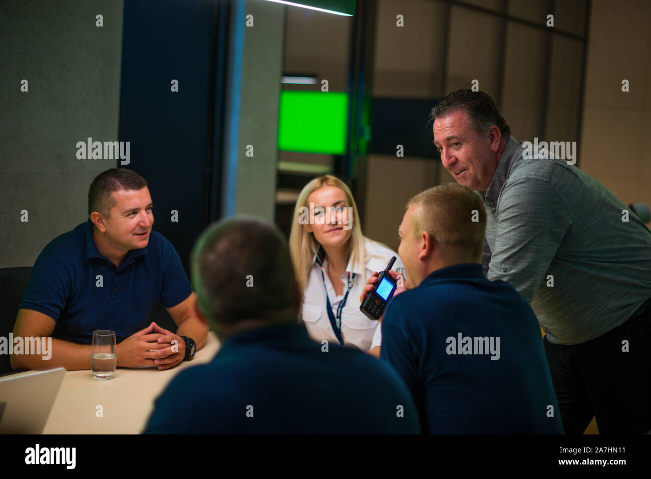 Security guard monitoring modern CCTV cameras in a surveillance room ...