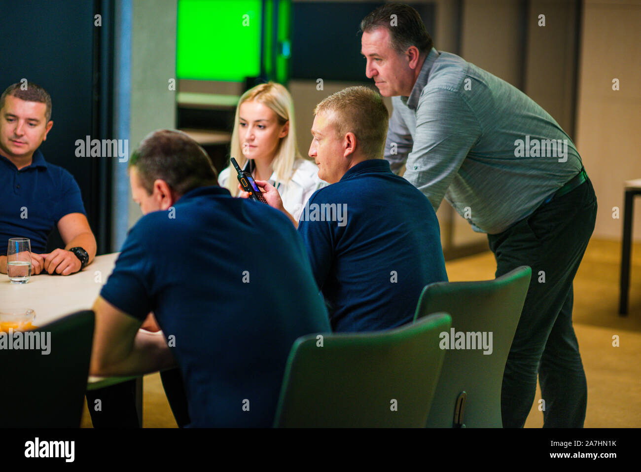 Security guard monitoring modern CCTV cameras in a surveillance room ...