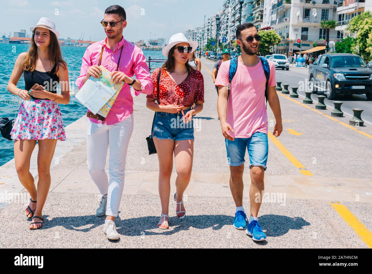 Tourists looking at a map and planning the places they are supposed to ...