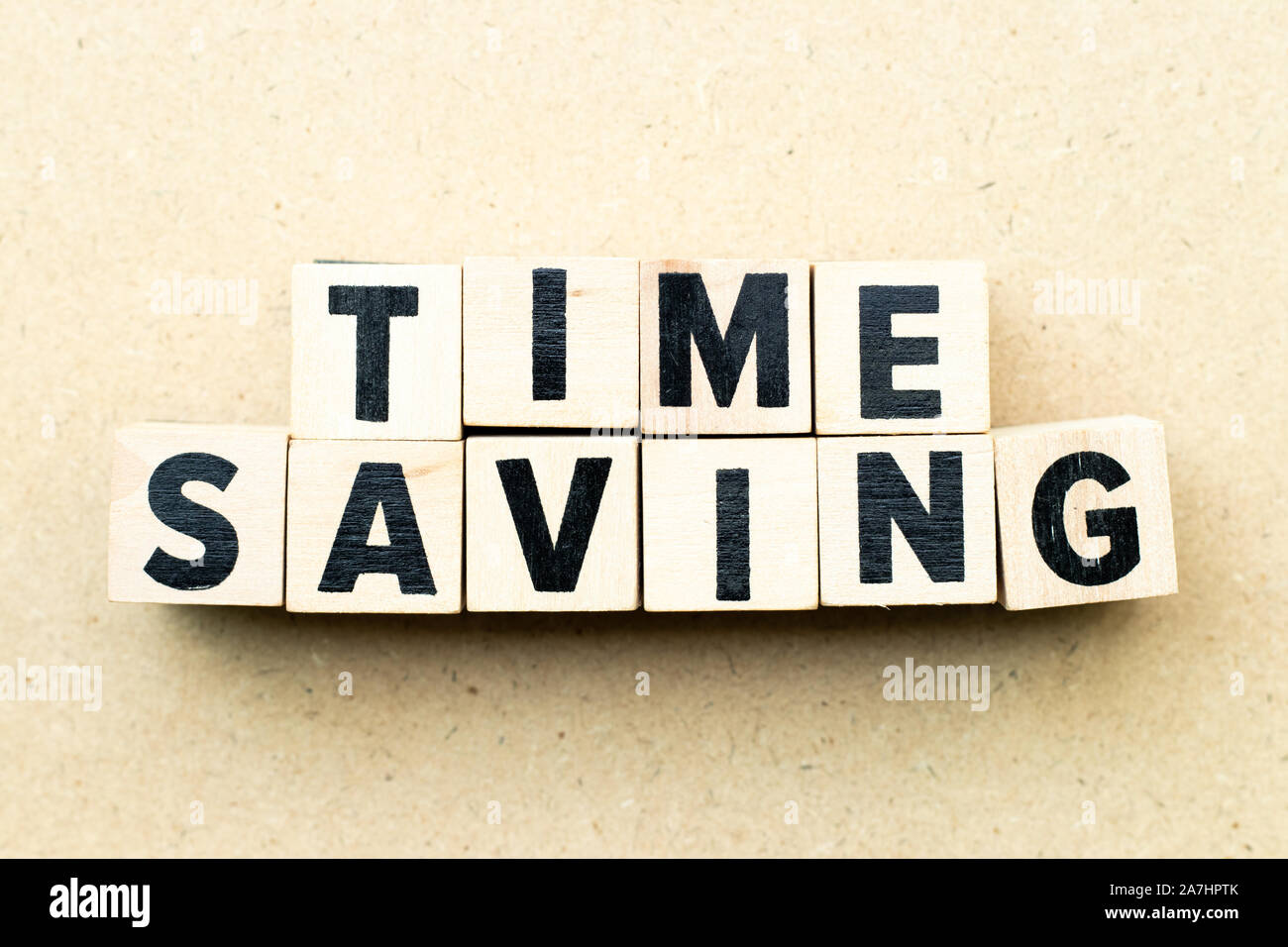 Letter block in word time saving on wood background Stock Photo - Alamy