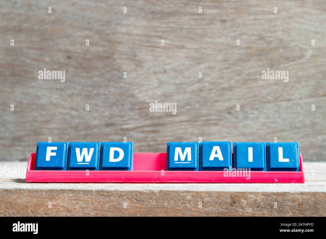Tile letter on red rack in word fwd mail on wood background Stock Photo ...