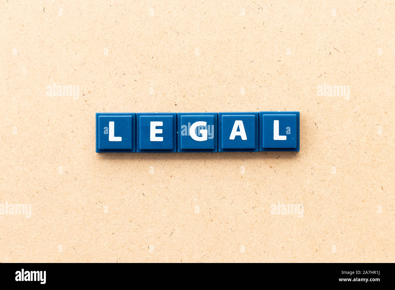 Tile letter in word legal on wood background Stock Photo - Alamy
