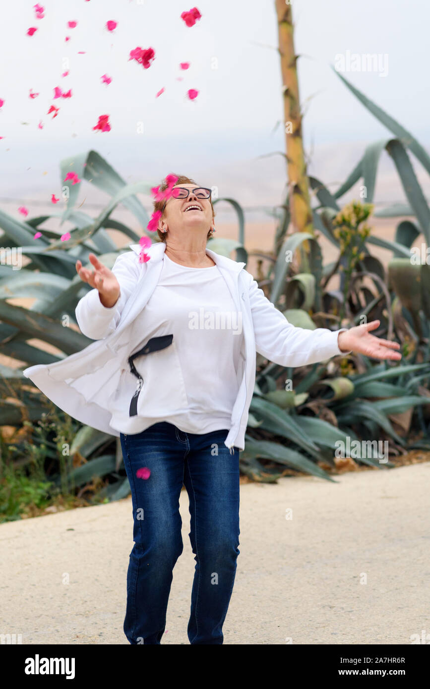 Lady throwing rose petals hi-res stock photography and images - Alamy