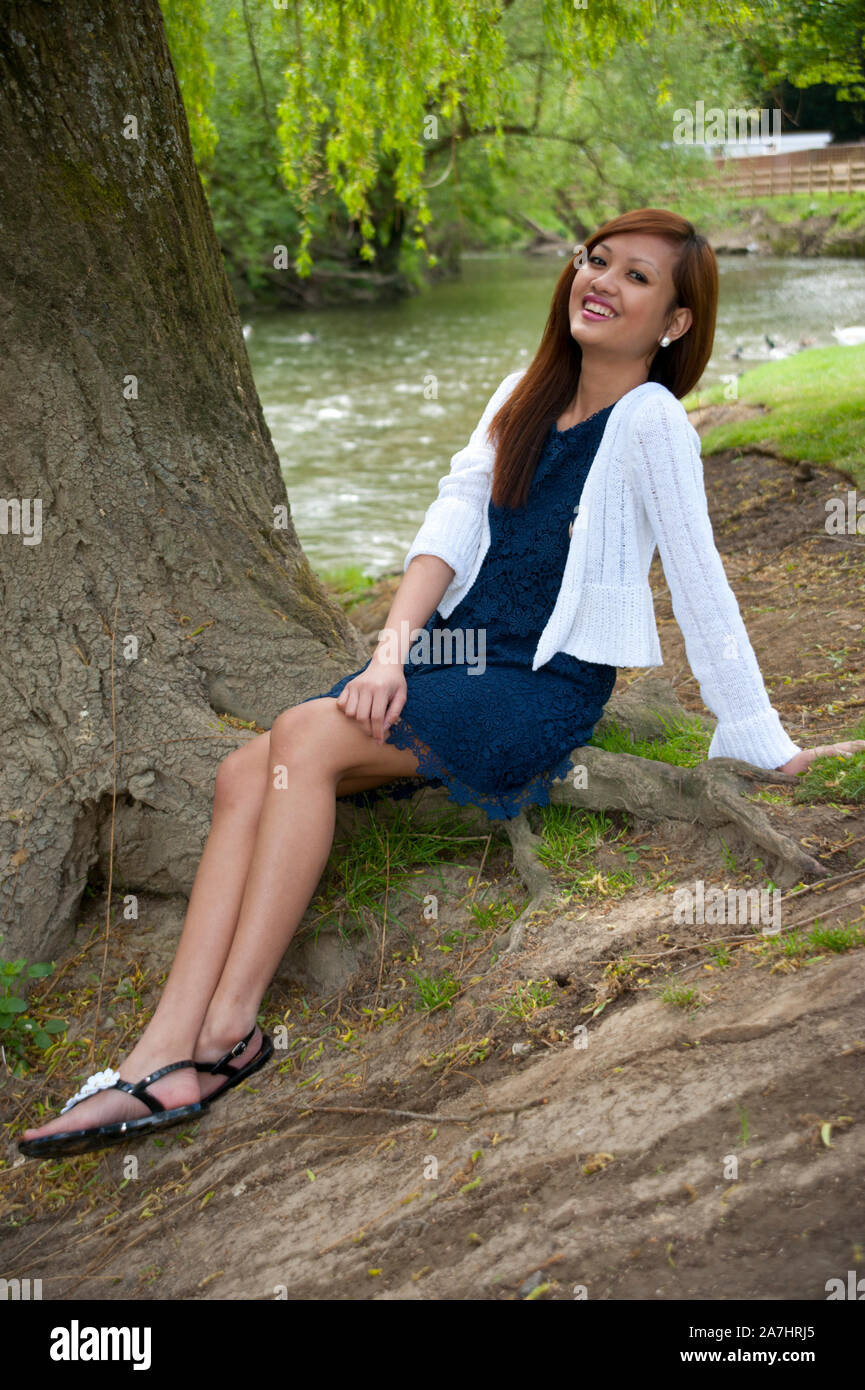 Pretty teenage Filipino girl 19 by river Stock Photo - Alamy