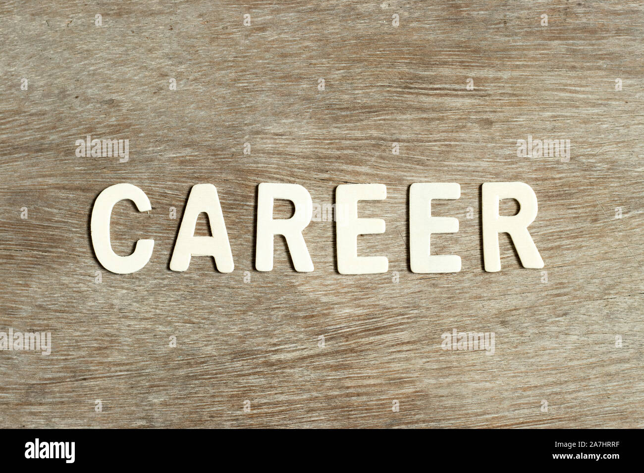Alphabet letter in word career on wood background Stock Photo - Alamy