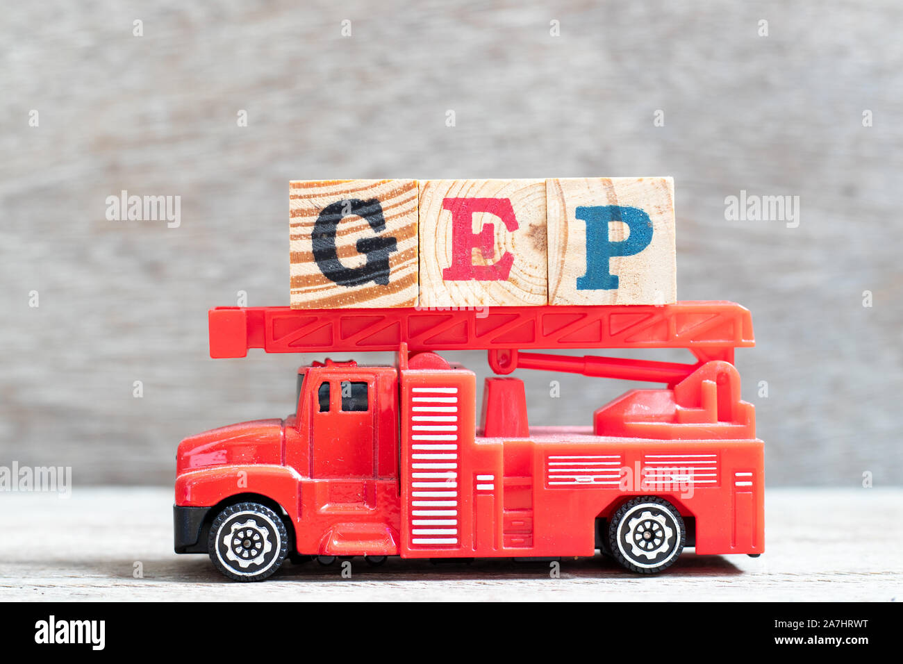 Red fire truck hold letter block in word GEP (Abbreviation of Good ...