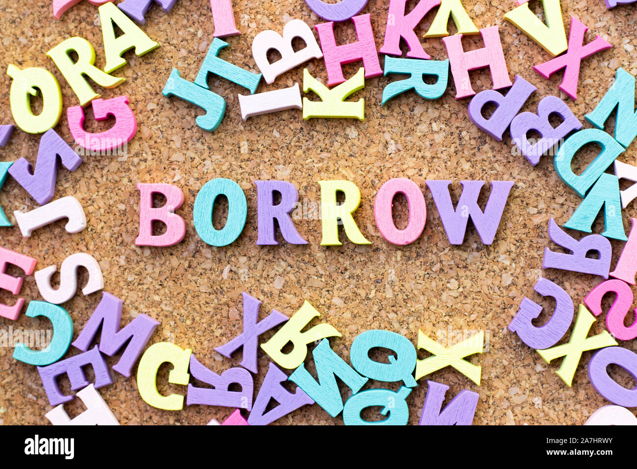 Color alphabet in word borrow with another letter as frame on cork ...
