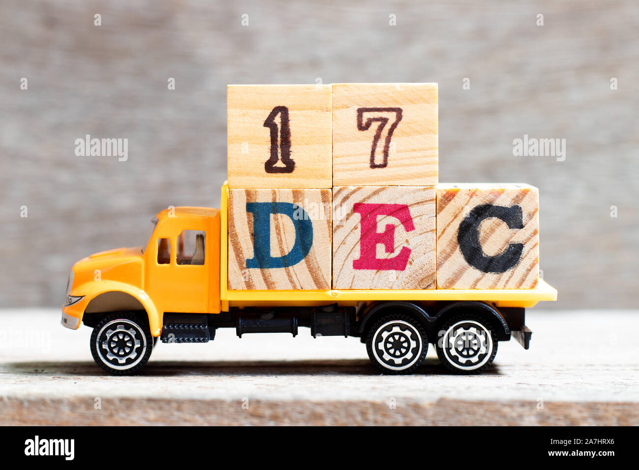 Truck hold letter block in word 17dec on wood background (Concept for ...
