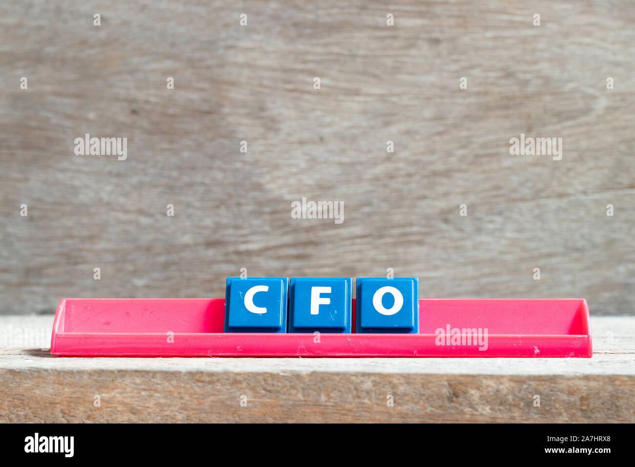 Tile letter on red rack in word CFO (Abbreviation of Chief Financial ...