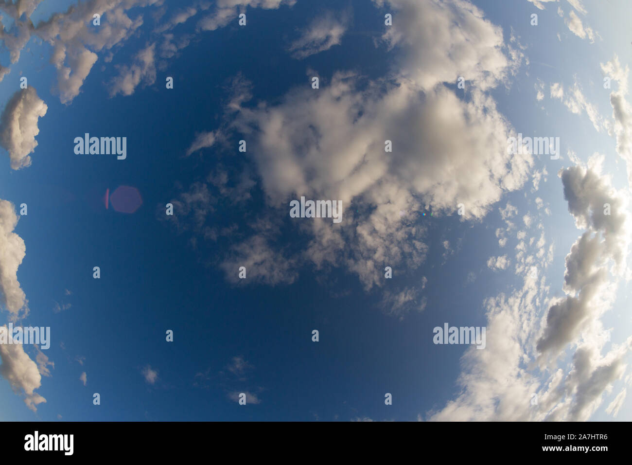 White clouds on the blue sky. Fish eye lens Stock Photo - Alamy