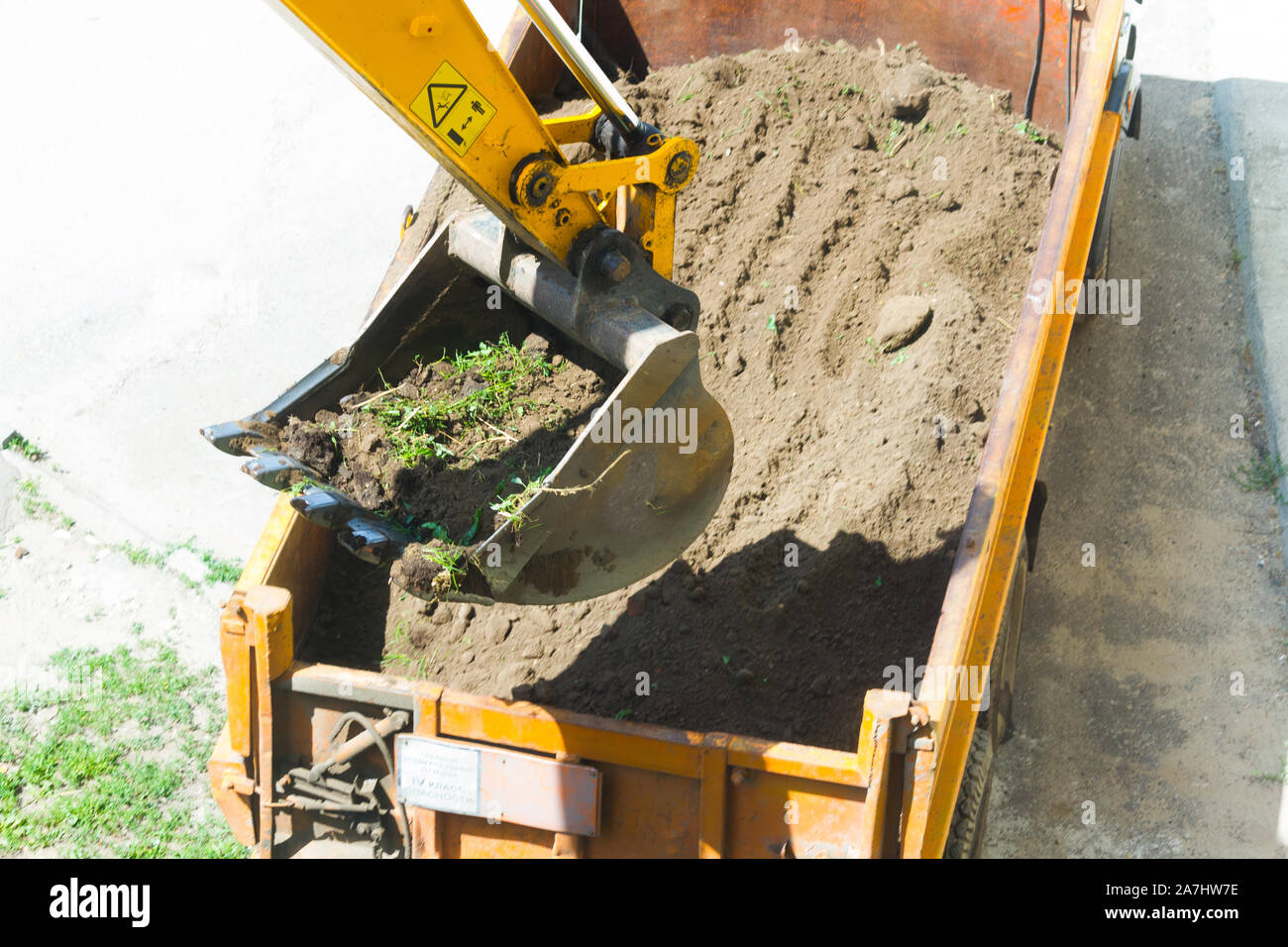 Excavation in construction site. Close up of excavator Stock Photo - Alamy